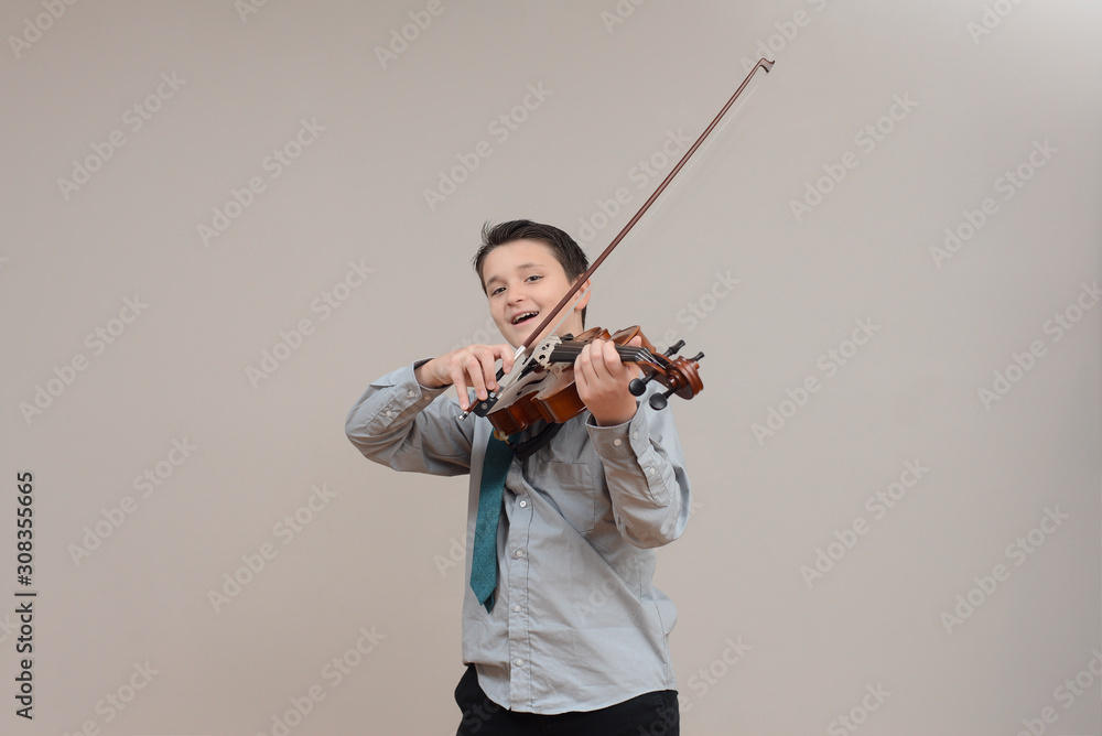Boy playing viola wearing shirt and tie Stock Photo | Adobe Stock