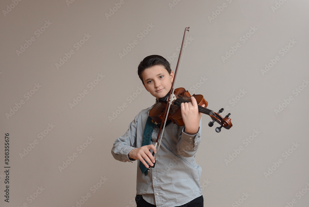 Boy playing viola wearing shirt and tie Stock Photo | Adobe Stock
