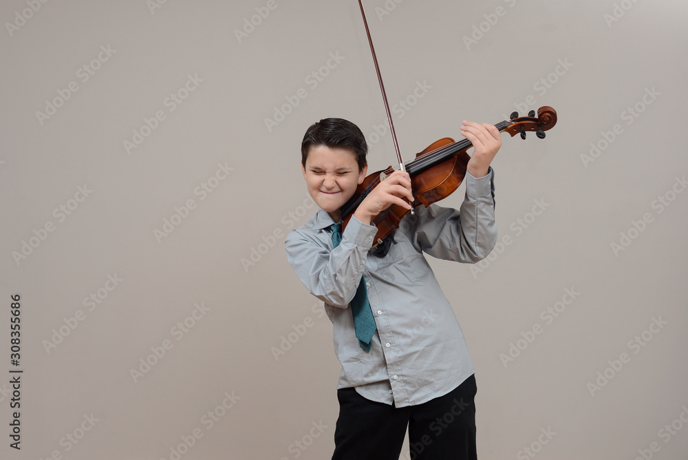 Boy playing viola wearing shirt and tie Stock Photo | Adobe Stock