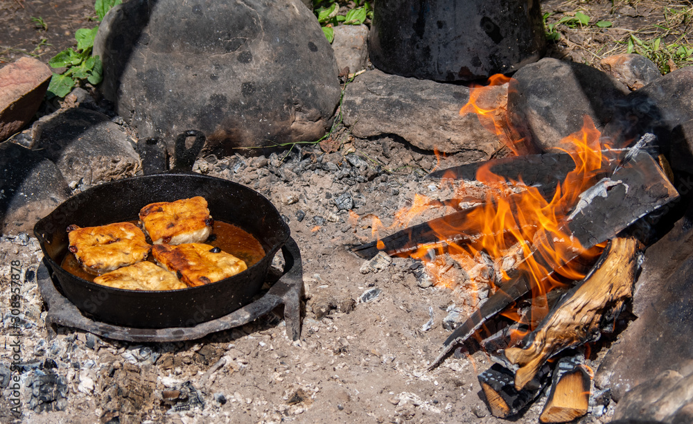 Frying bannock on the fire, Alberta, Canada Stock Photo | Adobe Stock