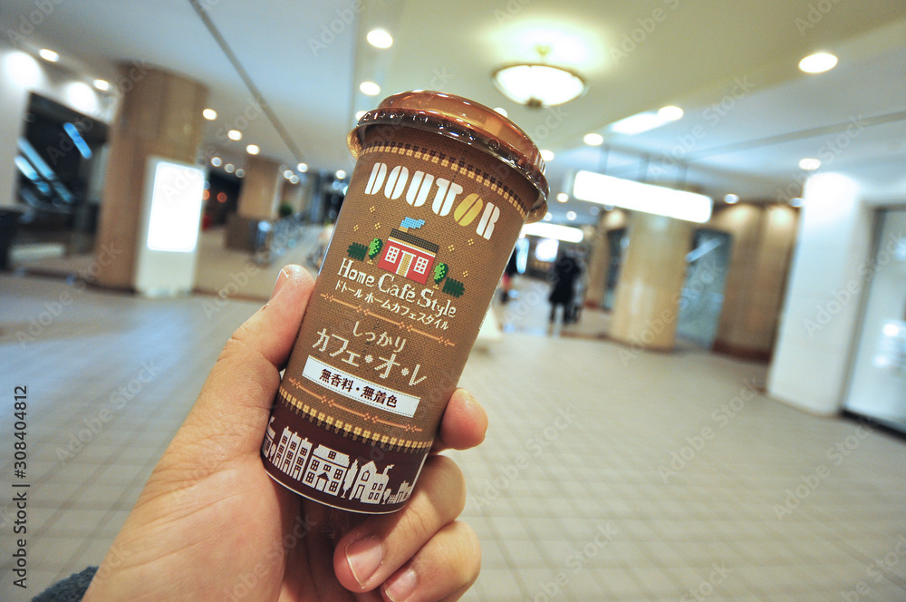 YOKOHAMA, JAPAN - DECEMBER 8, 2009_Doutor Ready-To-Drink Coffee in hand ...