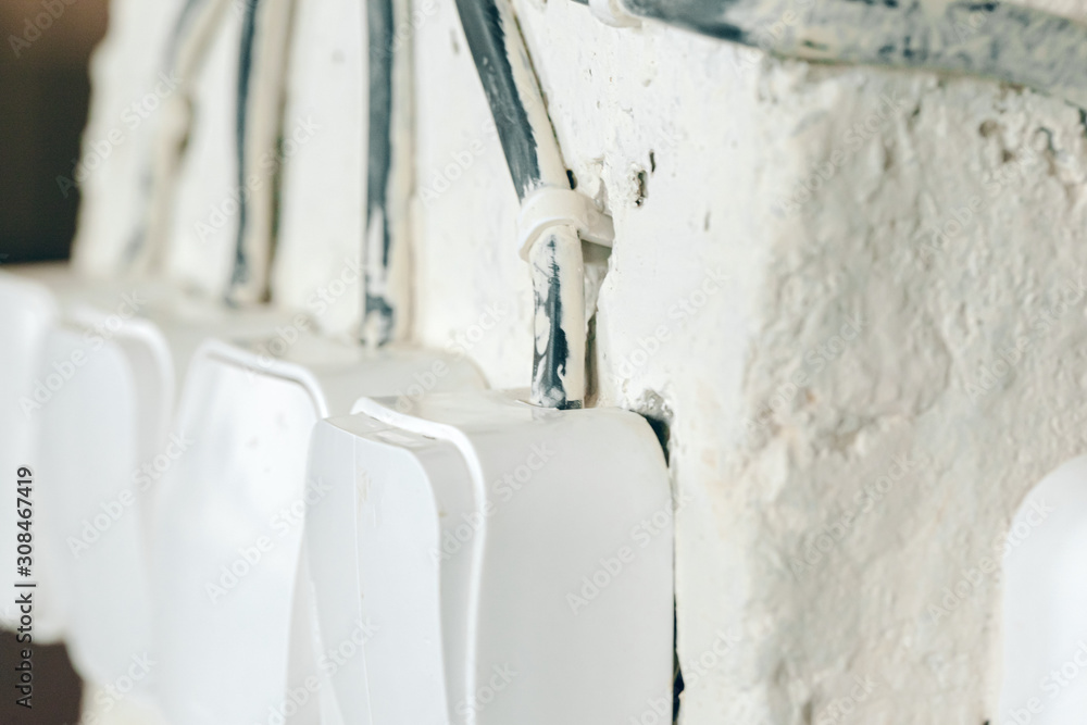 Dirty old fashioned light switch on rough wall Stock Photo | Adobe Stock