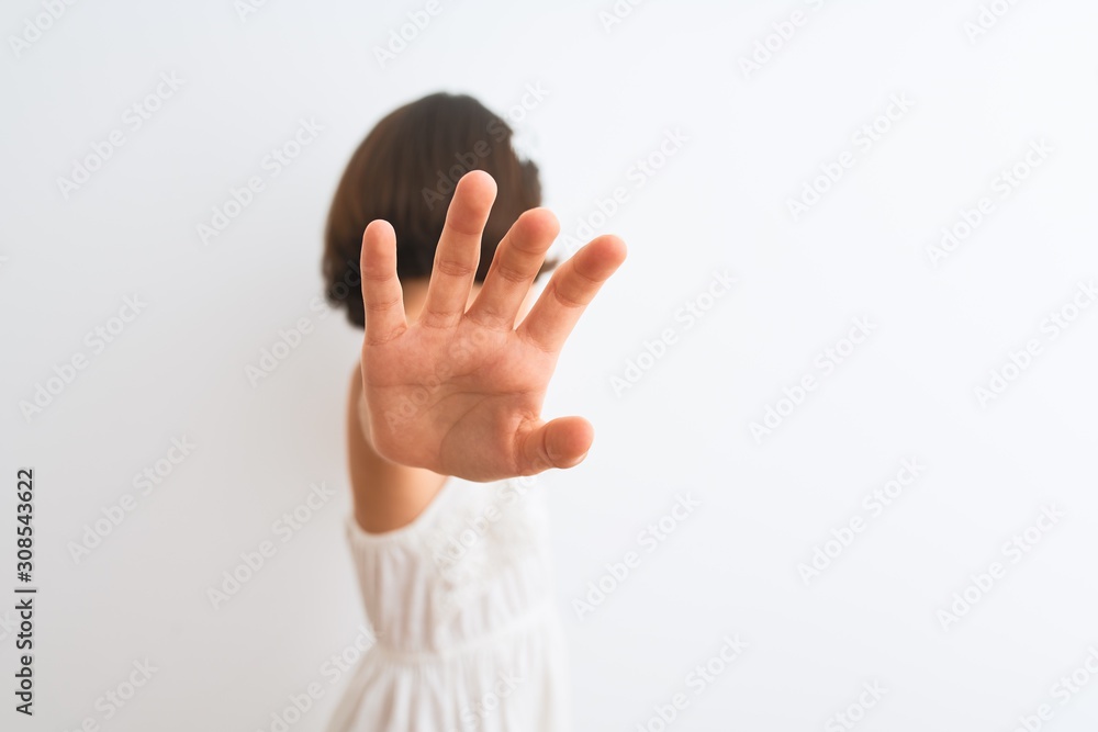 Beautiful child girl wearing princess crown standing over isolated ...