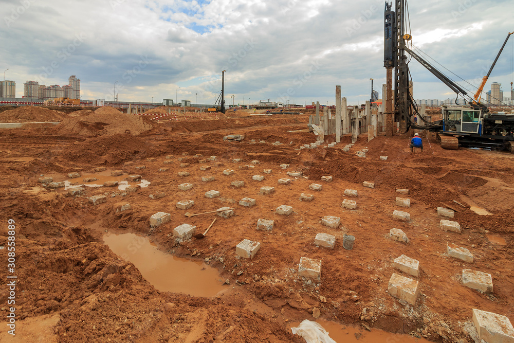 Pile driving in foundation pit construction apartment building. Piling ...