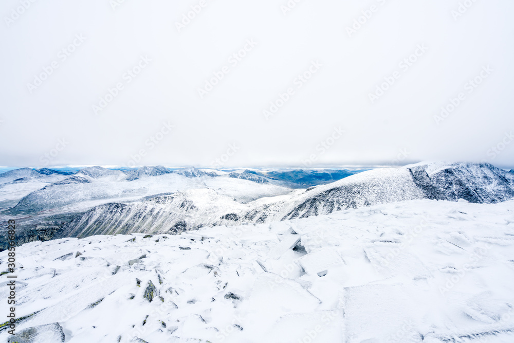 Snowy mountain peaks in Rondane national park in Norway. Snowy, foggy ...