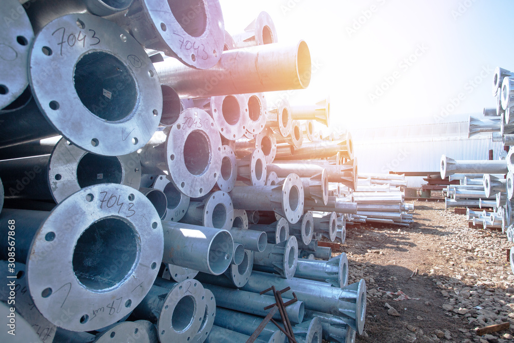 Metal warehouse outdoor of lighting poles. Storage of metal galvanized ...