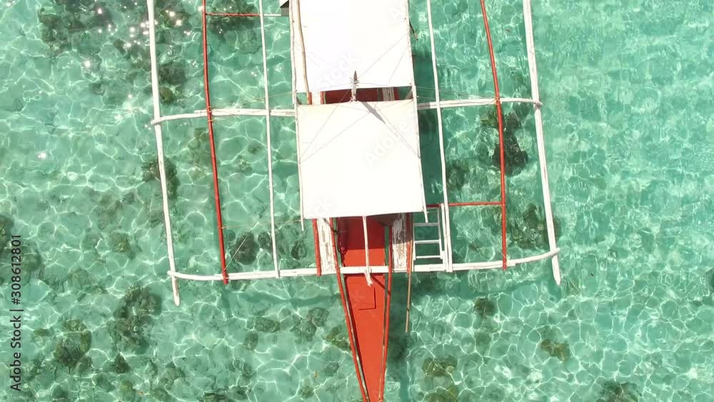 Overhead view of a tiny traditional pontoon boat with some rotation ...