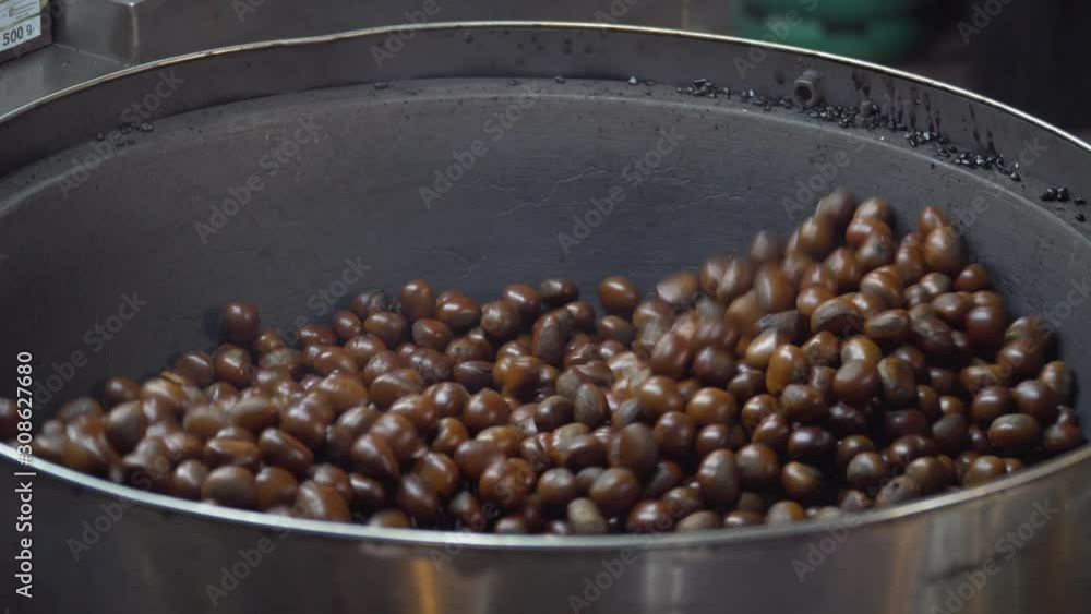 Chestnut roasting machine made from large wok or built pot and ...