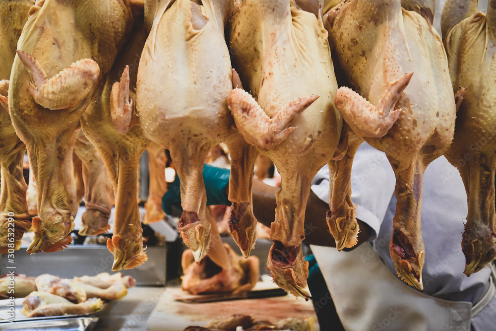 Plucked chickens hanging upside down at market in Lima Peru. Stock ...