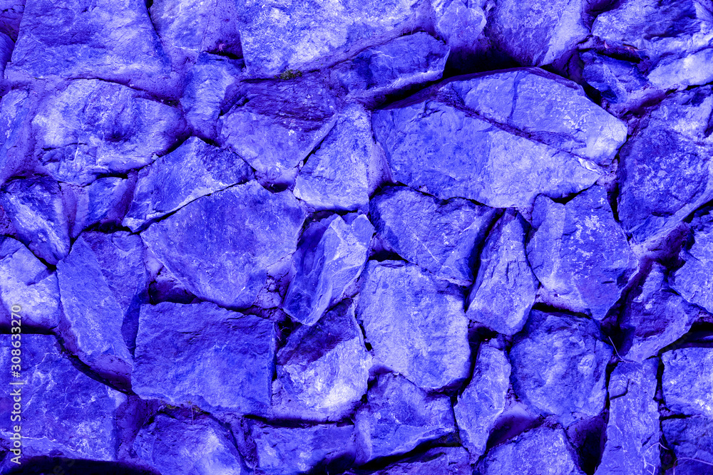 Background texture of a blue purple stone on the rock of the mountain ...