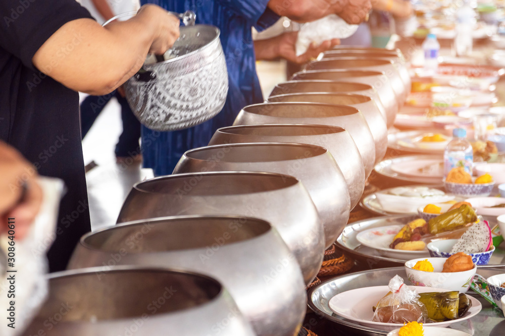 Buddhist alms giving ceremony in the morning. Offerings in a Monk's ...