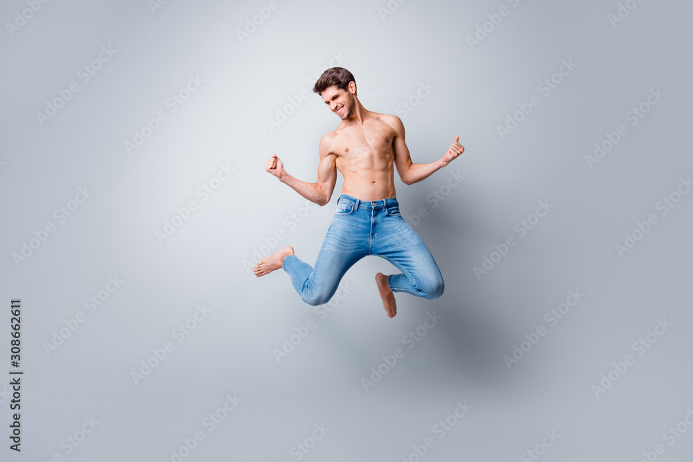Full length photo of crazy macho man guy jumping high topless torso ...