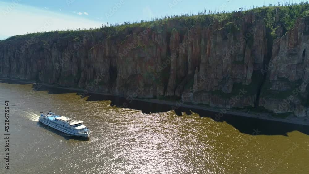 Cruise ship floating on largest river Lena unique pillars vertical ...