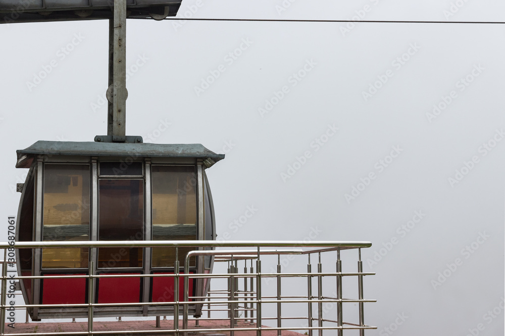 cabin of the cable car.The red cabin of the ropeway in the an Indian ...