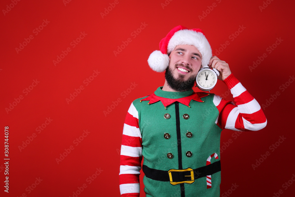 Studio portrait of handsome bearded man wearing traditional elf costume ...
