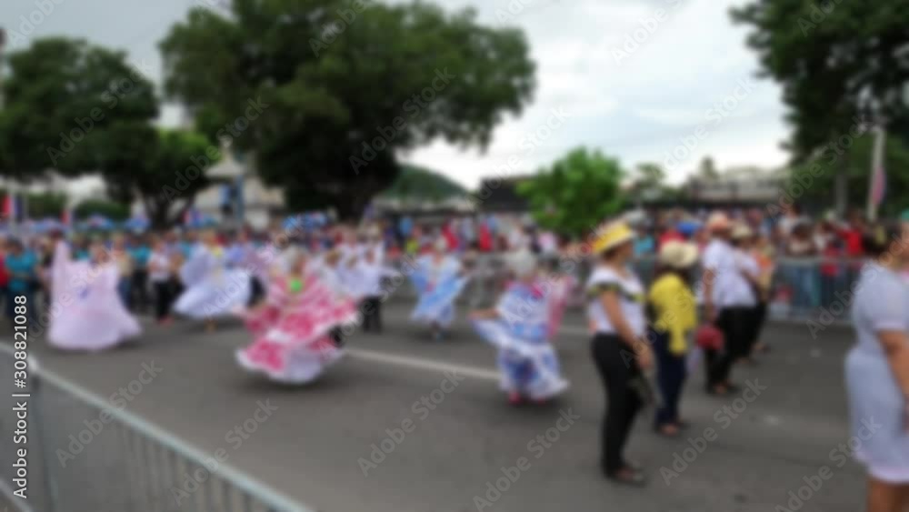 Blurred video of traditional young Panamanian dancers in the street at ...