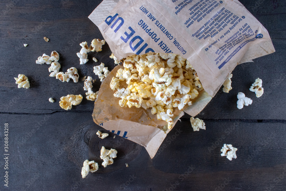 popped bag popcorn torn open and spilling out flat lay Stock Photo ...