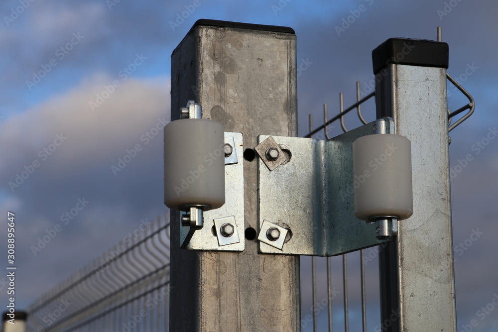 Guide bracket with Rollers. Parts of Sliding Gate system Stock Photo ...