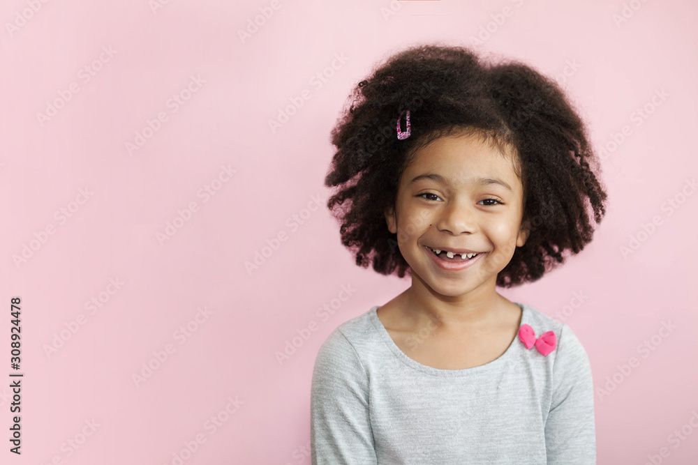 Happy adorable african american child girl isolated on pastel ...