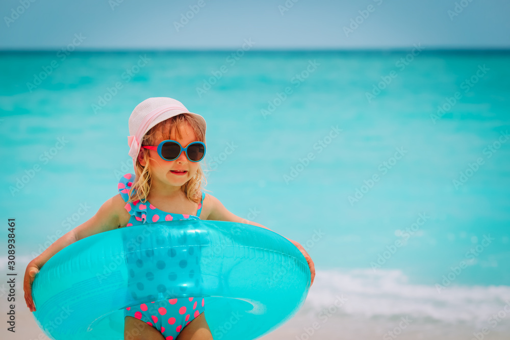 happy cute little girl with floatie at tropical beach Stock Photo ...