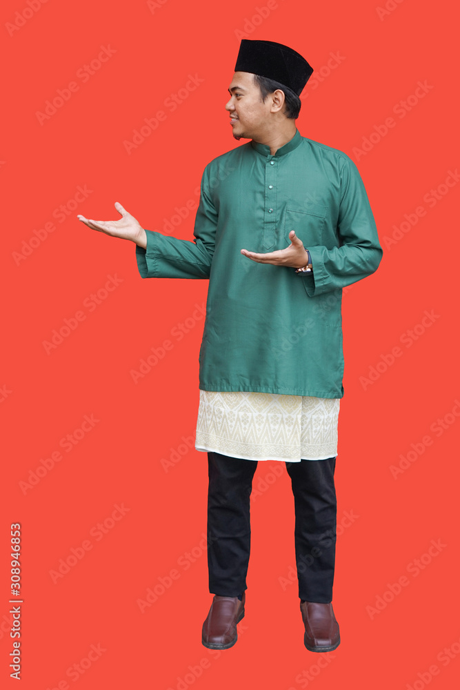 potrait young malay muslim man happy face with green wearing Malaysian ...