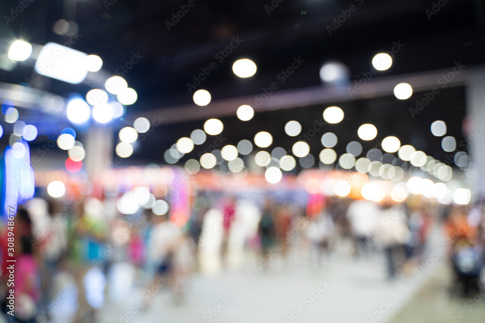 Blurred images of trade fairs in the big hall. image of people walking ...