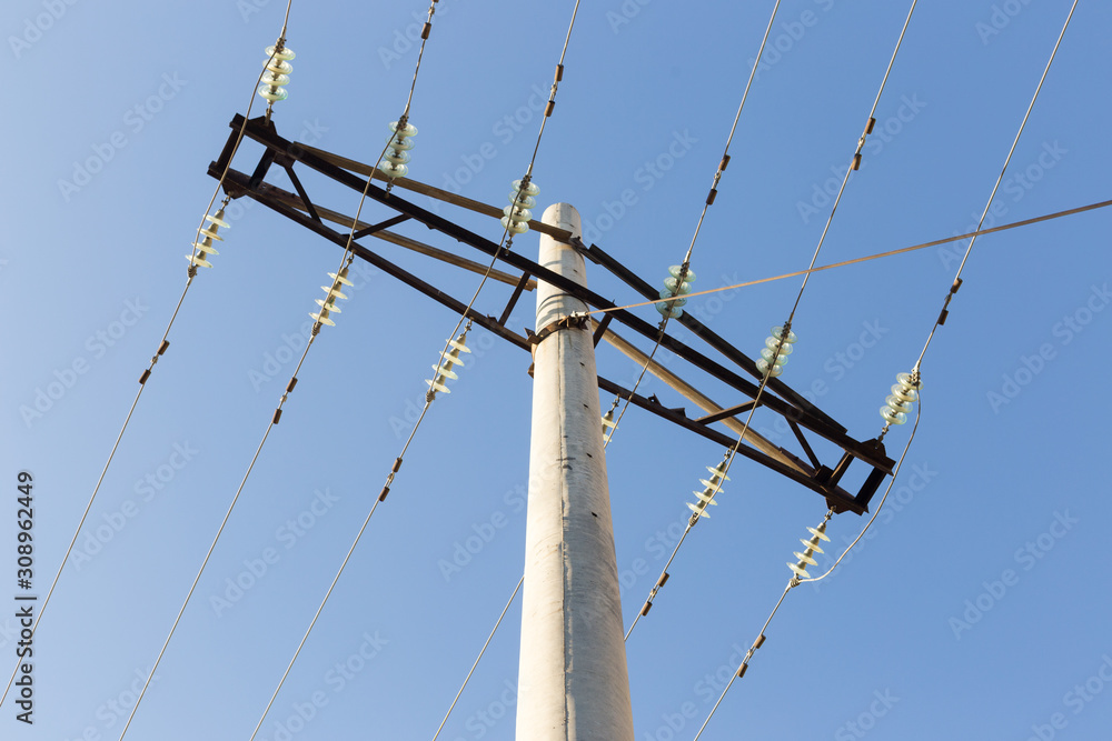 Concrete pillar power lines with steel traverses, porcelain insulators ...