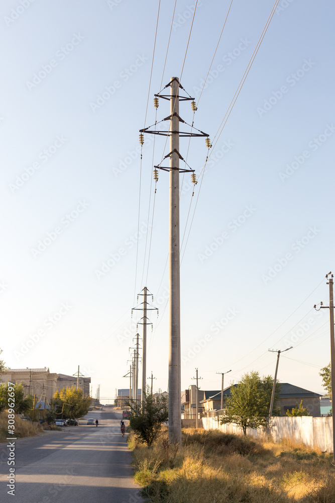 Concrete pillar power lines with steel traverses, porcelain insulators ...