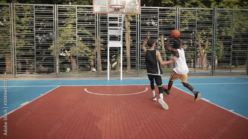 Two Young Mixed Race Active Guys Playing Basketball,One on One on the ...
