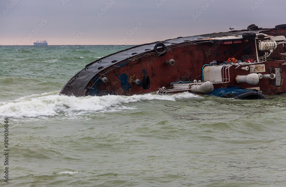 Feed of a sinking tanker ship in a sea water with a raid vessel on ...