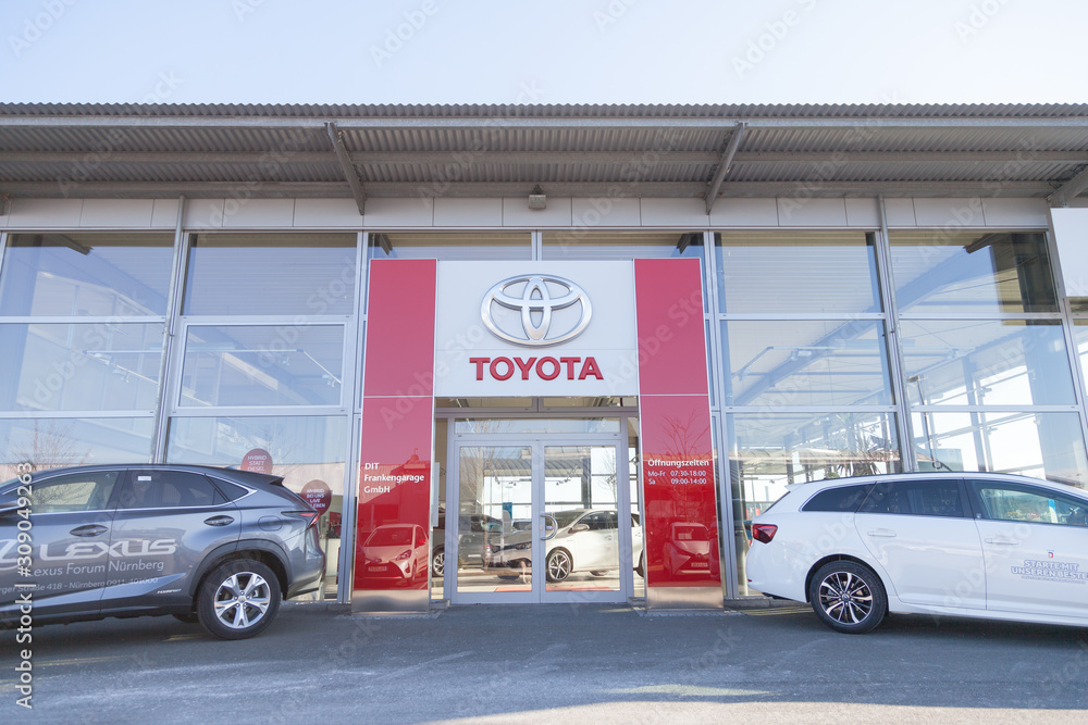 FUERTH / GERMANY - FEBRUARY 25, 2018: Toyota logo near a car dealer ...