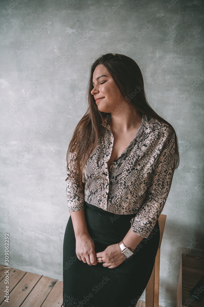 Plus size fashion model in casual clothes, woman on studio background ...