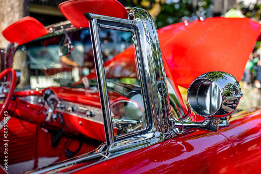 Open bright red vintage retro convertible car with chrome details and ...