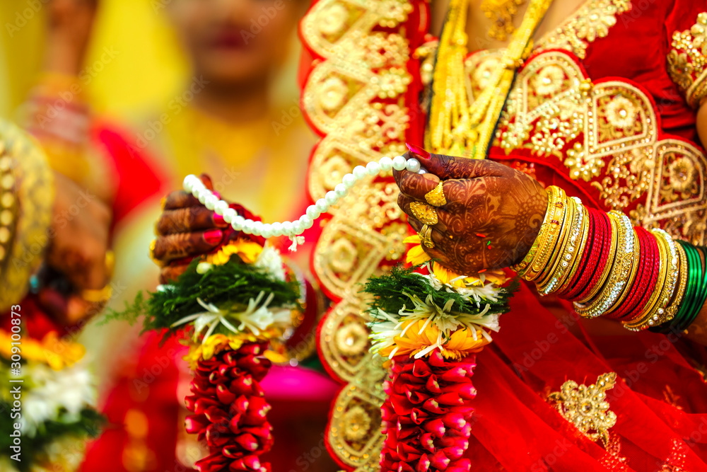 Traditional indian wedding ceremony, groom holding hand in bride hand ...