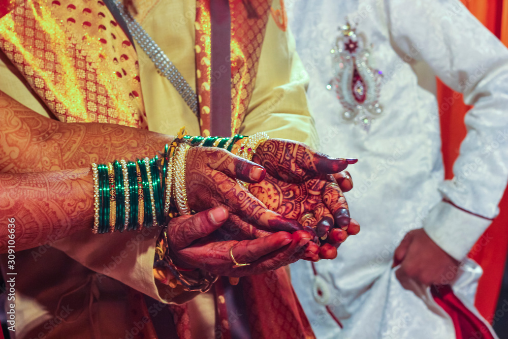 Traditional indian wedding ceremony, groom holding hand in bride hand ...