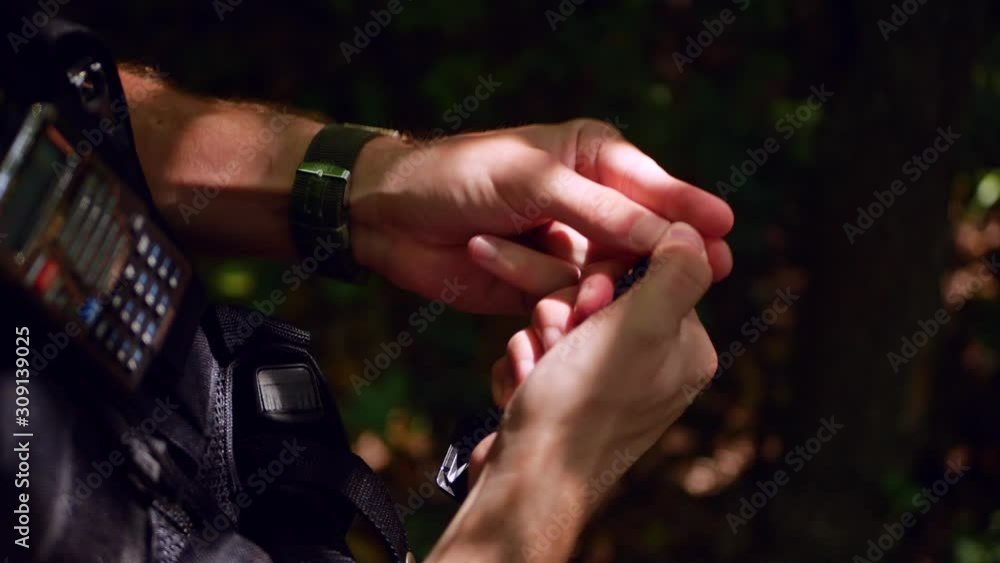 A Sport Shooters is Filling Gun Cartridges with Bullets in the forest ...