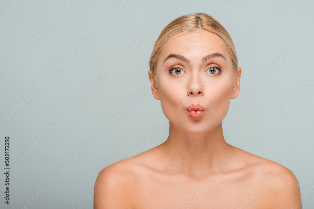 beautiful naked woman with duck face looking at camera isolated on grey Stock-Foto | Adobe Stock
