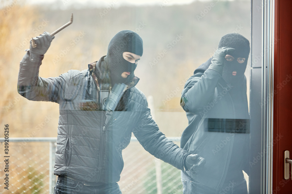 Breakers with crowbars hit windows Stock Photo | Adobe Stock