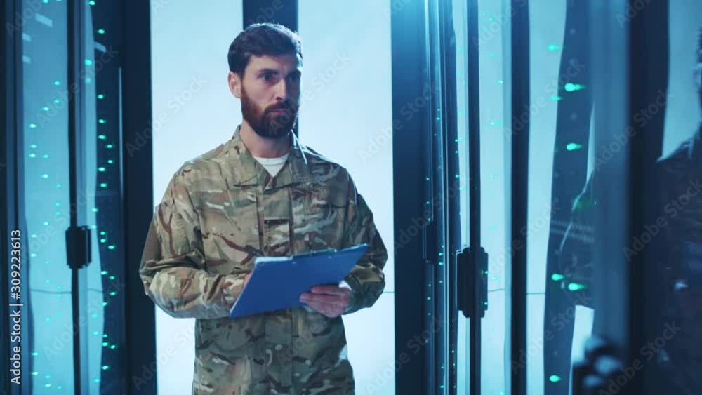 Bearded military man working in cyber security, intercepting data ...