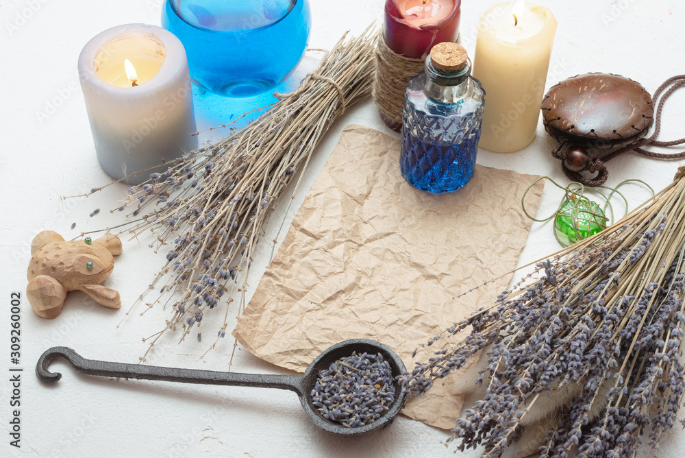 Old magic scroll with copy space and dried lavender flowers on mage ...