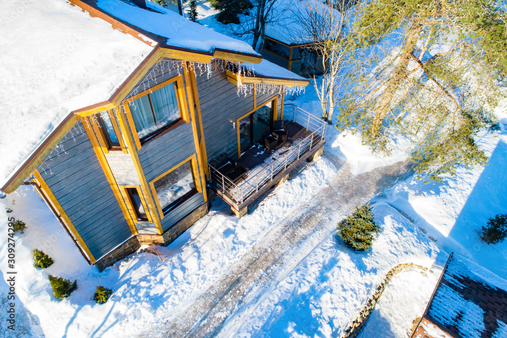 Two-story house top view. Wooden cottage. Frame house in winter weather ...
