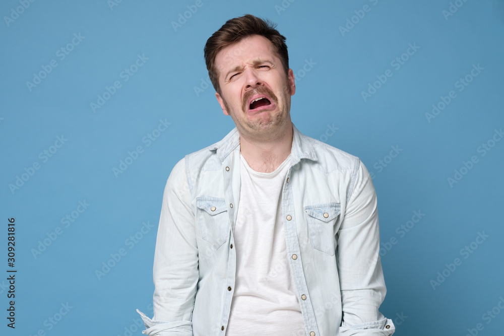 Funny caucasian man crying wipes tears losing his job. Stock Photo ...