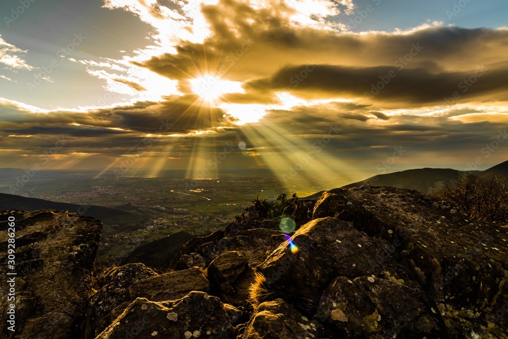 Bright sun rays falling on rock formations Stock Photo | Adobe Stock