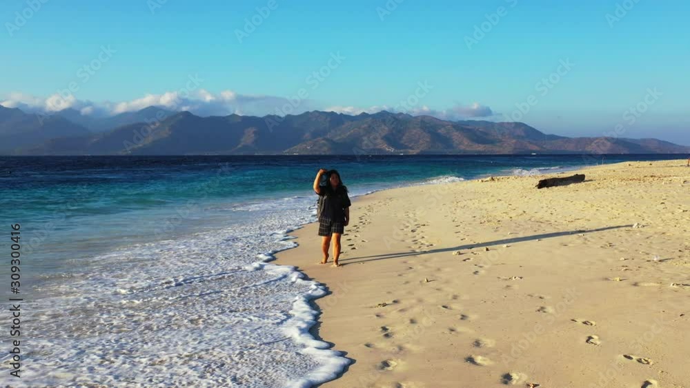 Girl enjoying fresh air of tropical island, walking around exotic beach ...