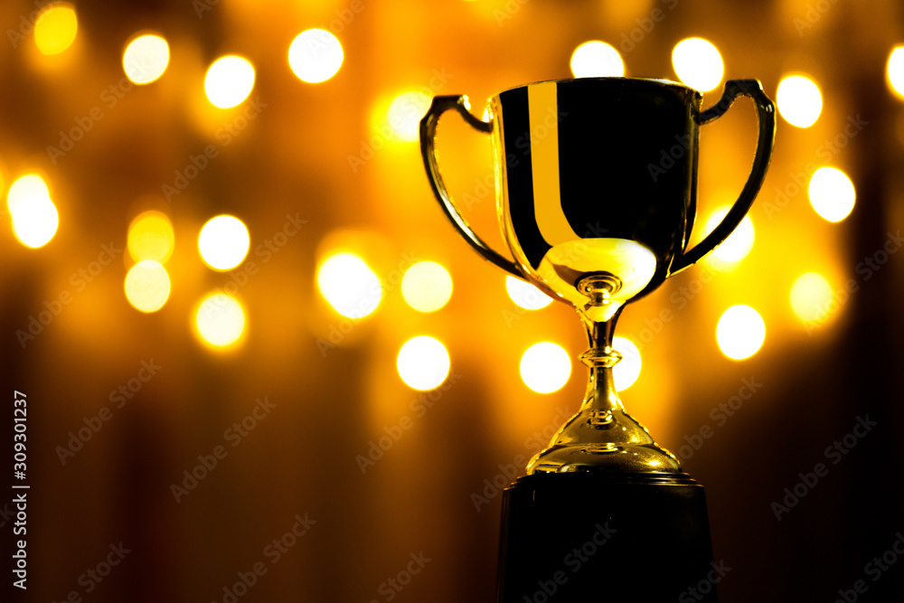 Gold trophy on the background bokeh lights for the award ceremony Stock ...
