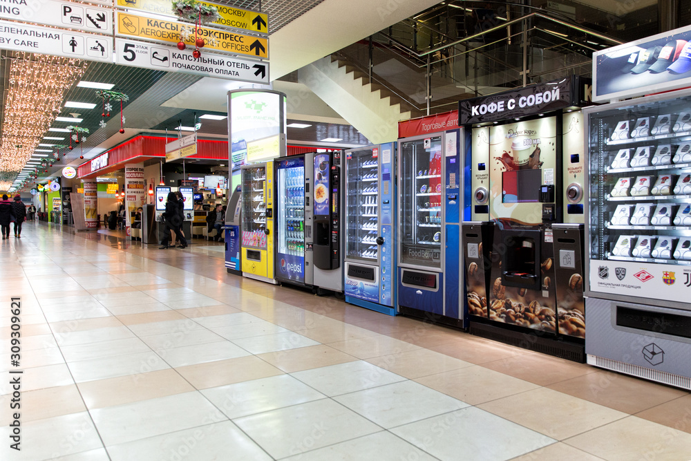 Vending machines for drinks and food. Interior of the waiting room at ...