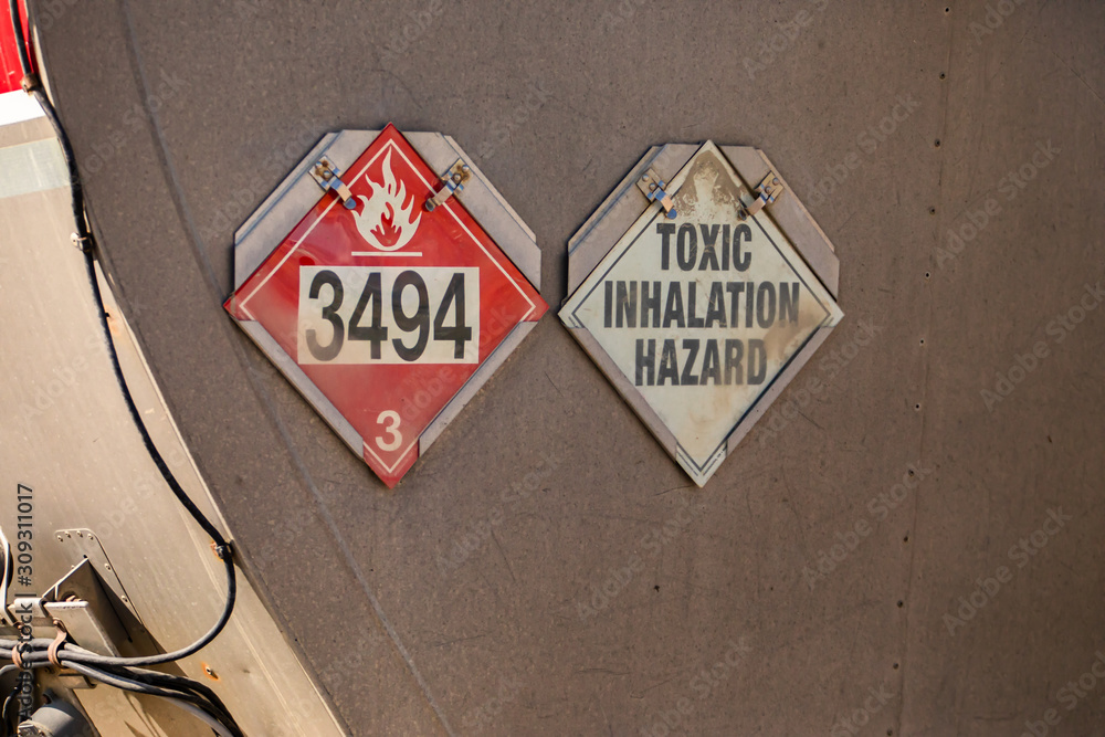 Close up on red Fire sign with 3494 fire symbol and white toxic ...