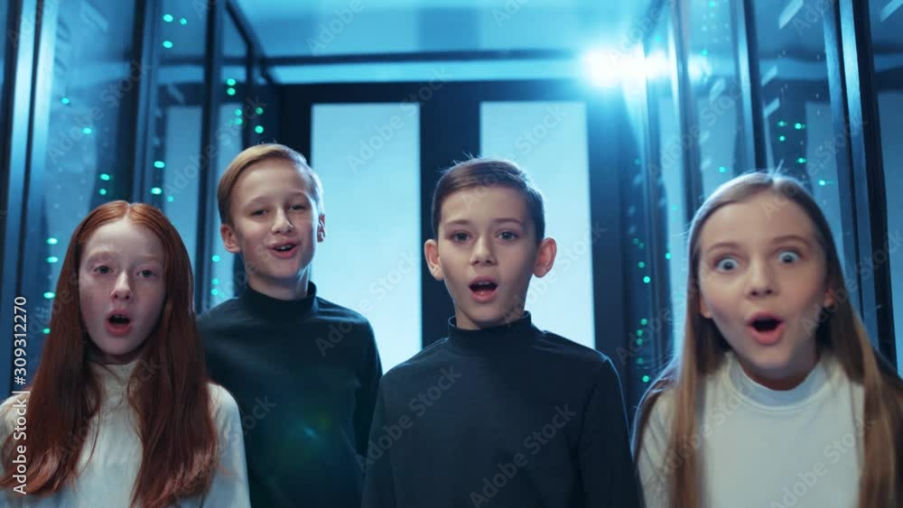 Video Stock In data center, young excited team of future kids staying ...