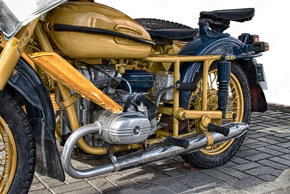 Old yellow motorcycle with a sidecar. The ancient model. Stock Photo ...