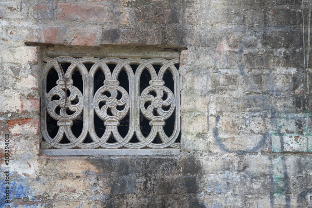Beautiful vintage ancient old carved window with glass with a forged ...